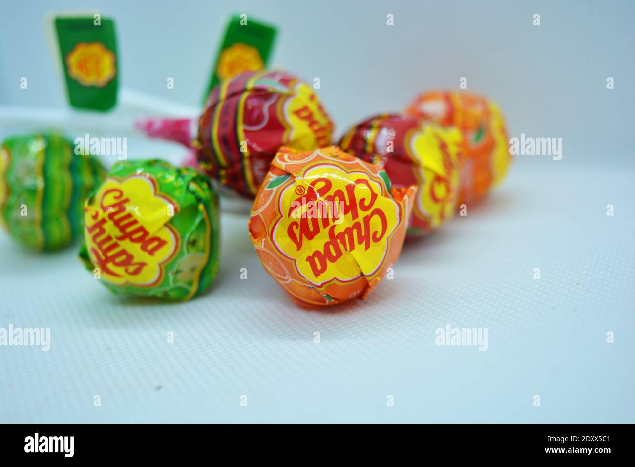 A handful of bright, colorful, popular sucking candies, round candies ...