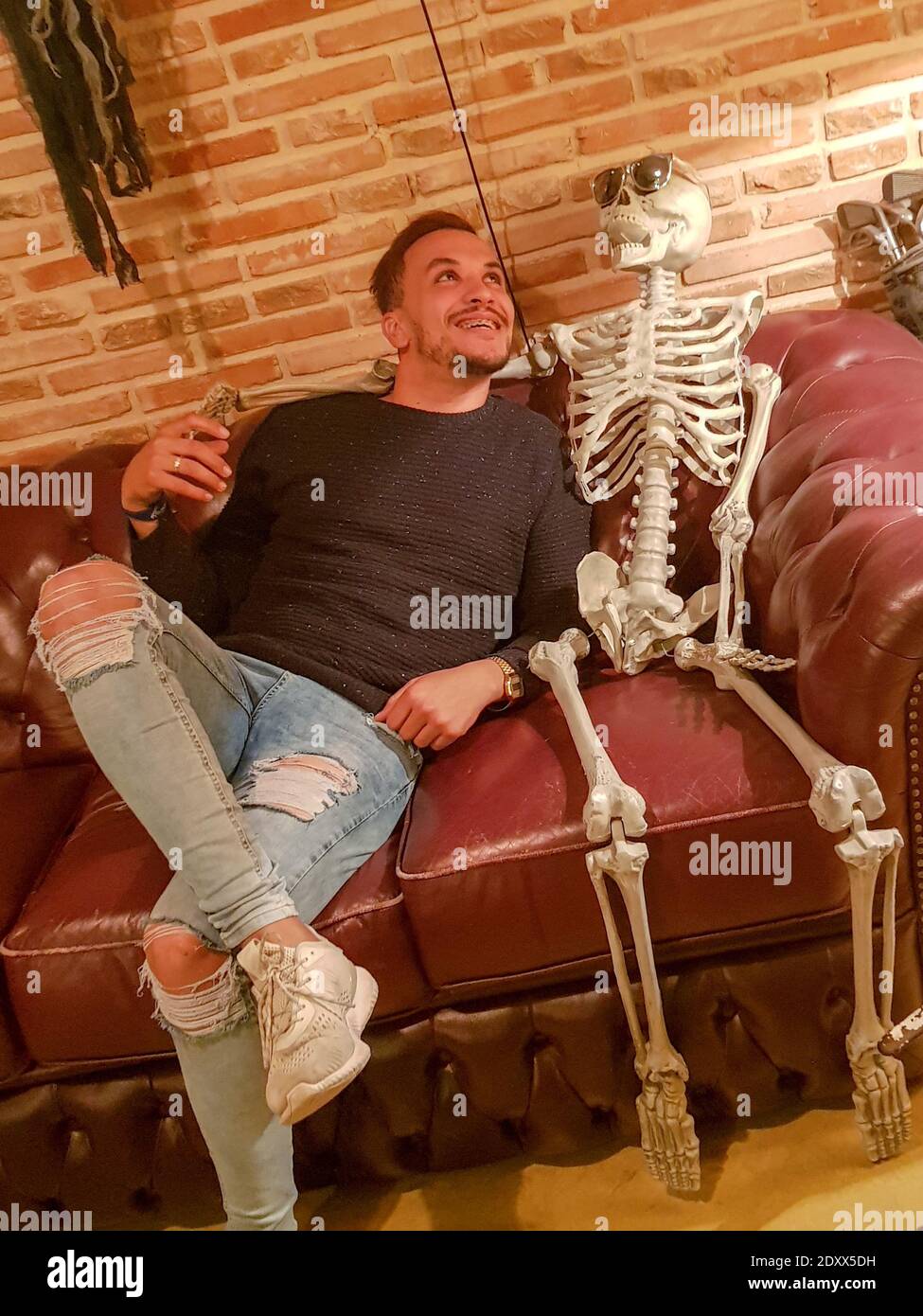 Human skeleton sitting hi-res stock photography and images - Alamy