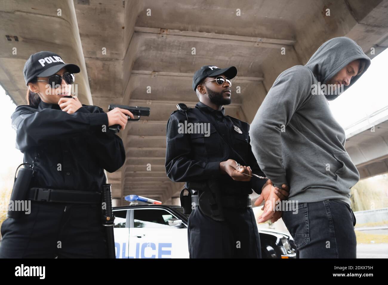 African american policeman handcuffing hi-res stock photography and ...