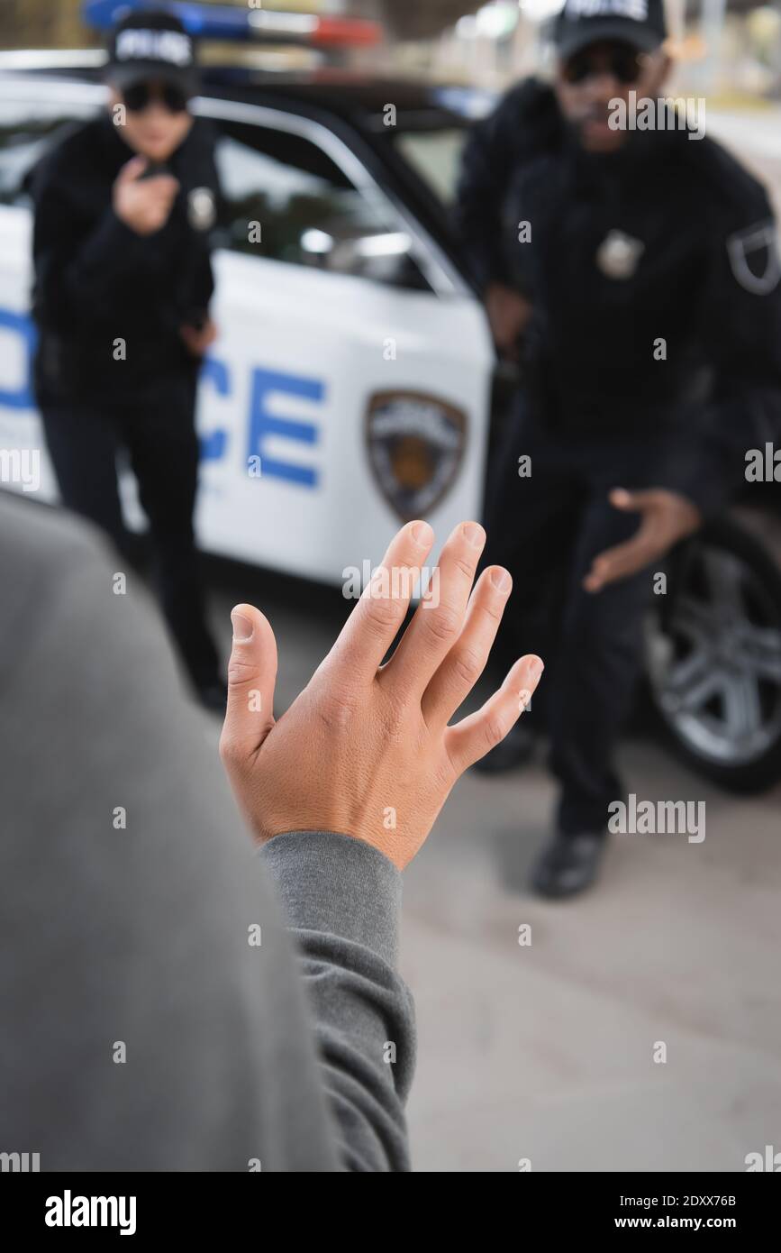 close up view of offender showing hand with blurred multicultural ...