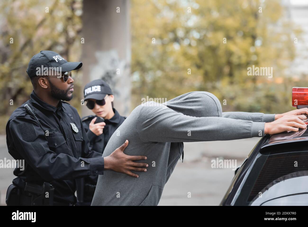 Leaning on police car hi-res stock photography and images - Alamy