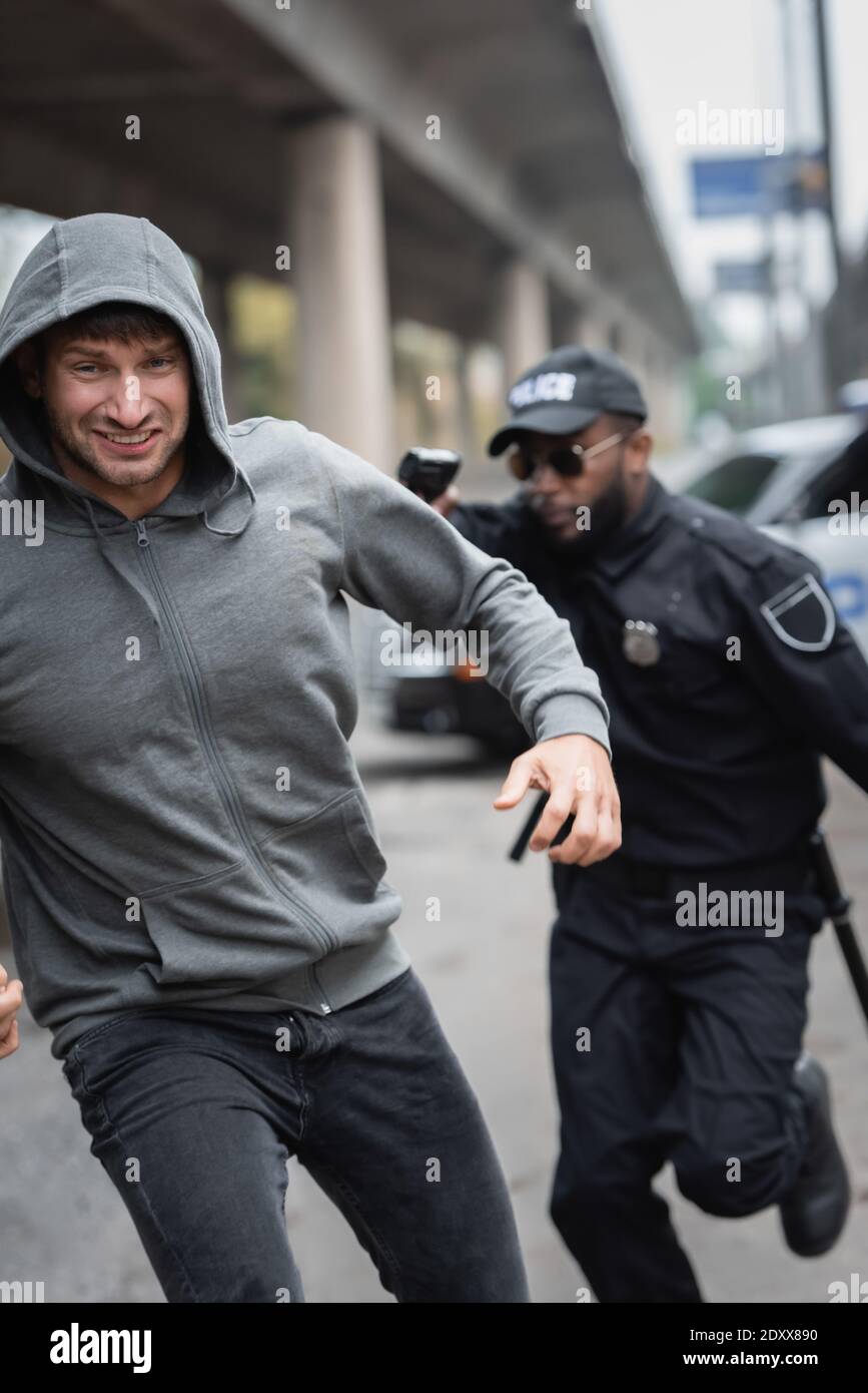 Running police blur hi-res stock photography and images - Alamy