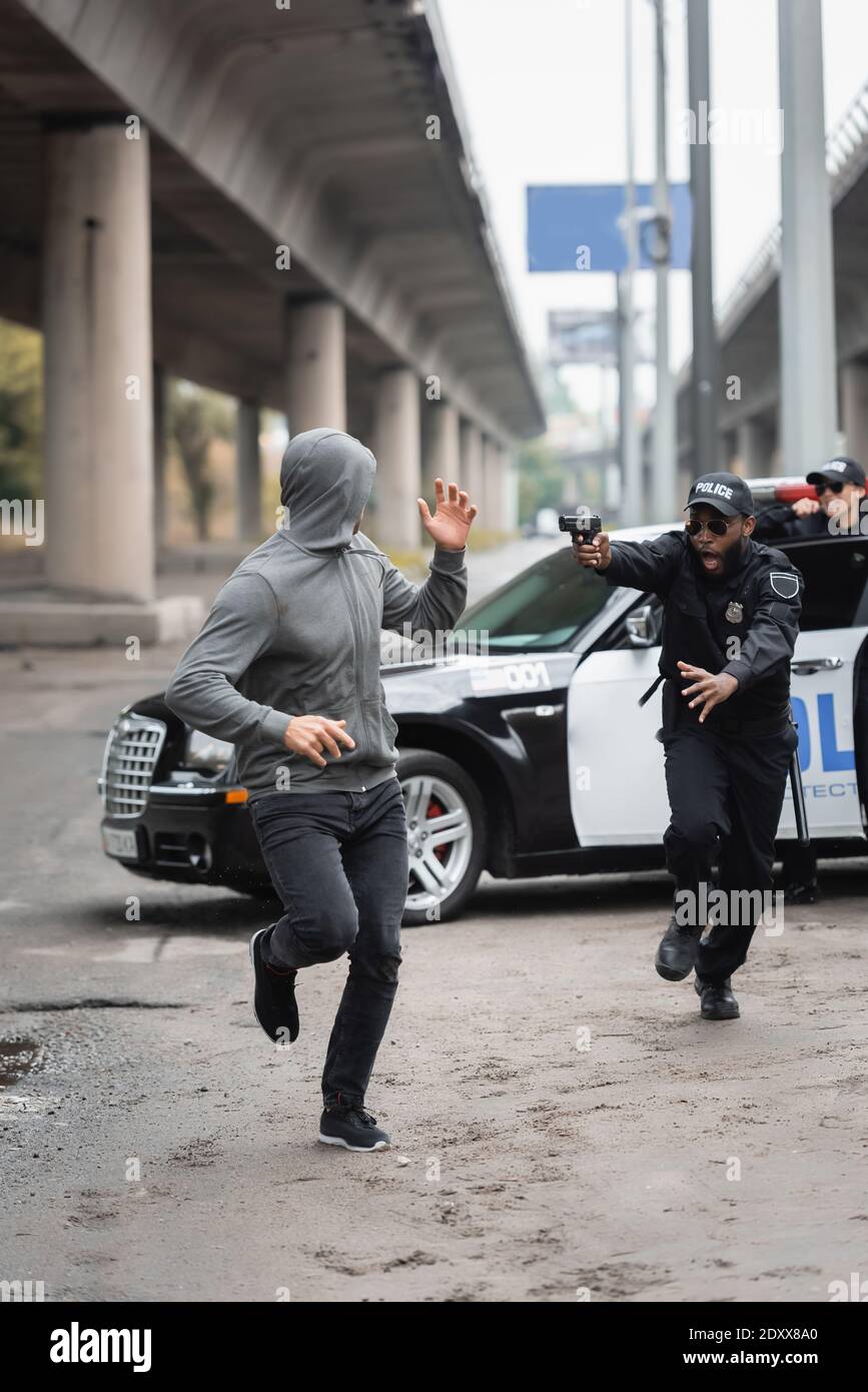 Full length man gun running hi-res stock photography and images - Alamy