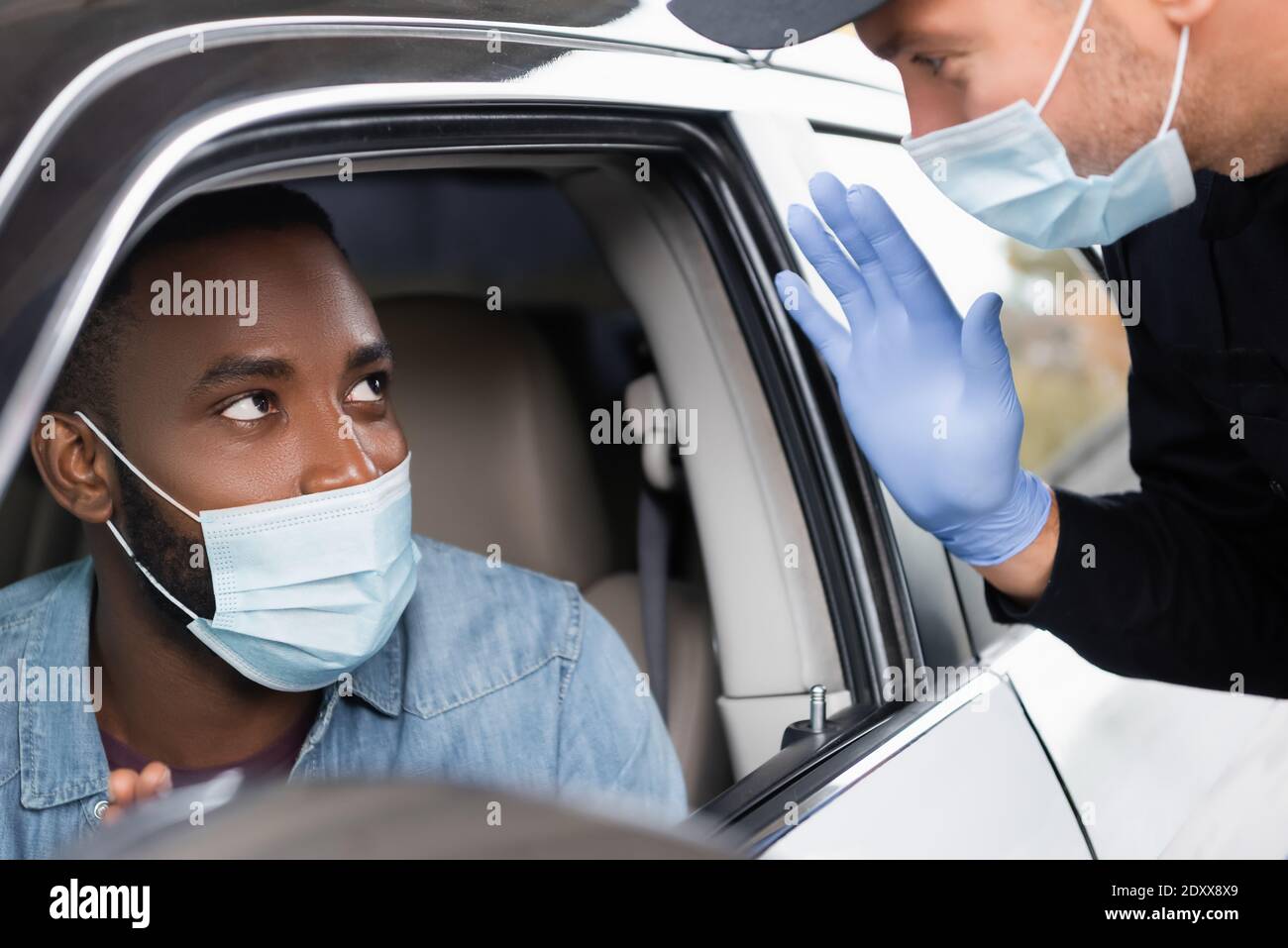 African american police with masks hi-res stock photography and images ...