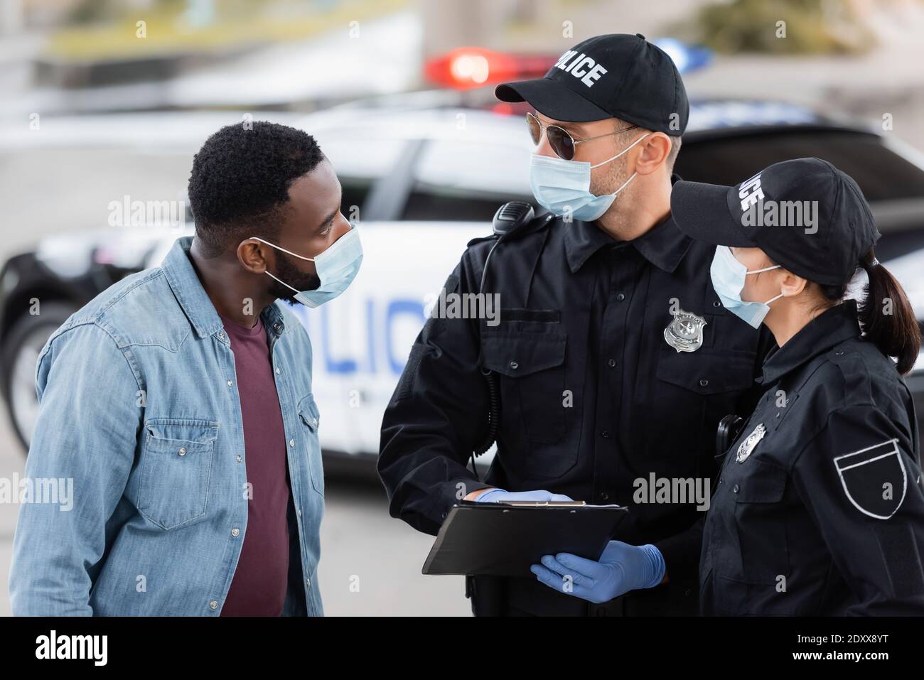 African american police with masks hi-res stock photography and images ...