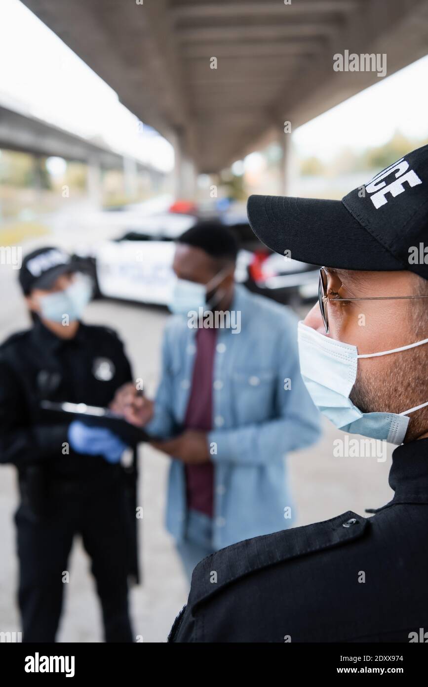 African american police with masks hi-res stock photography and images ...