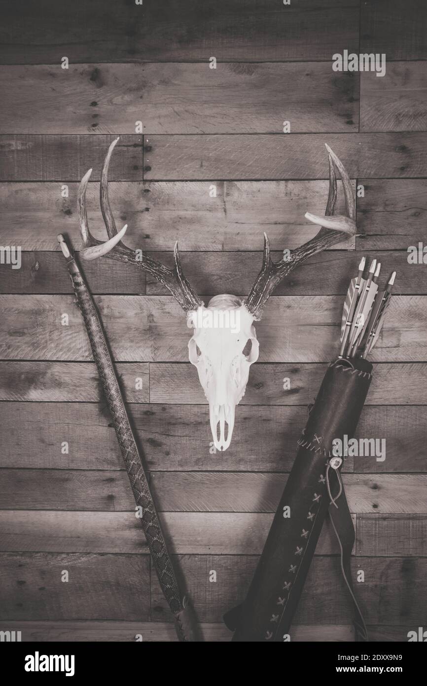 A traditional archery hunting scene with bow, quiver of arrows, and ...