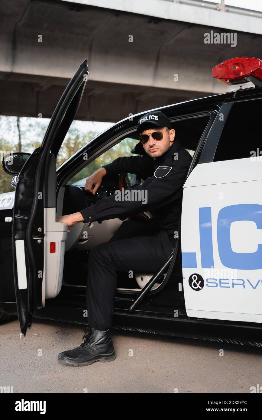 Sitting on police car hi-res stock photography and images - Alamy