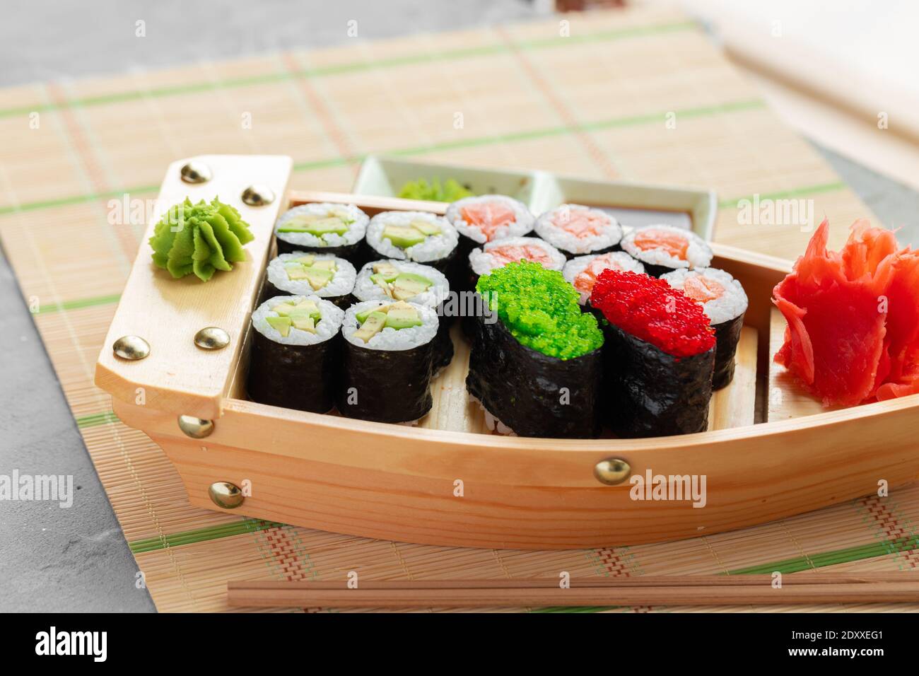 Set of maki sushi on wooden boat tray Stock Photo - Alamy
