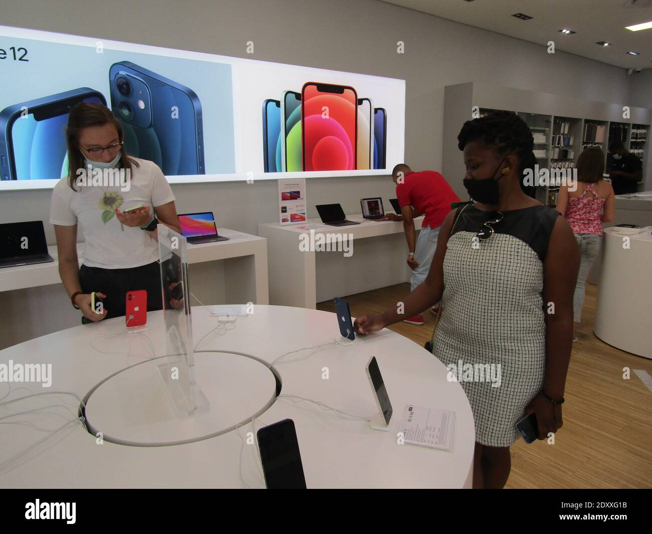 Windhoek, Namibia. 24th Dec, 2020. People select cellphones at a ...