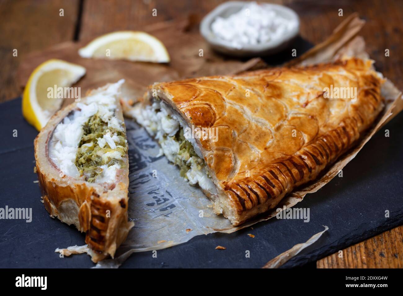 Sea bass wellington, fish baked in puff pastry Stock Photo - Alamy