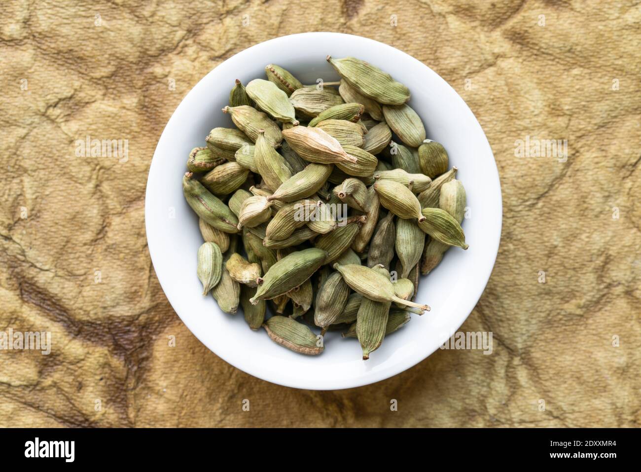 Green Cardamom Pods in a Bowl Stock Photo - Alamy