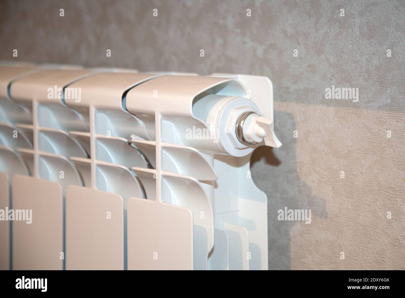 regulator on a white home heating radiator on a light wall Stock Photo ...