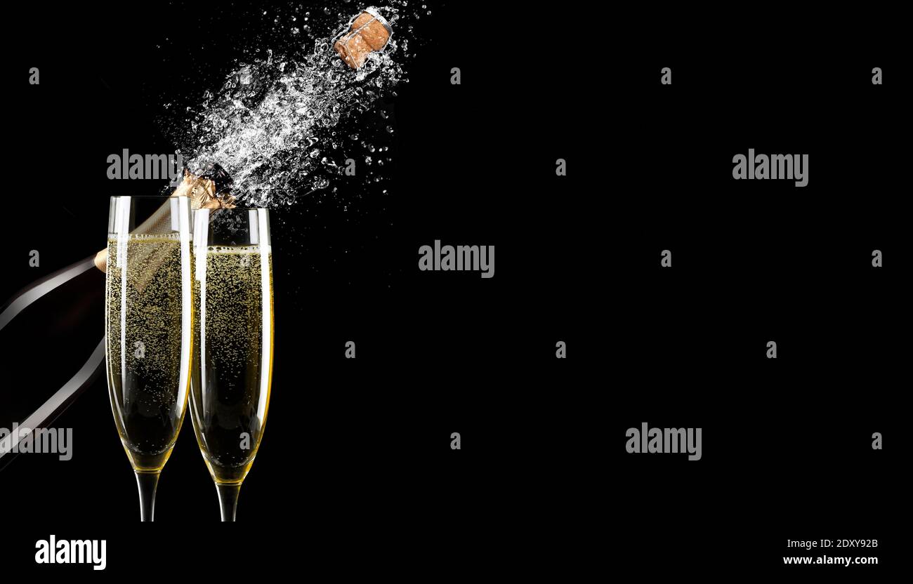 Glasses of champagne with splash, celebration theme concept Stock Photo ...