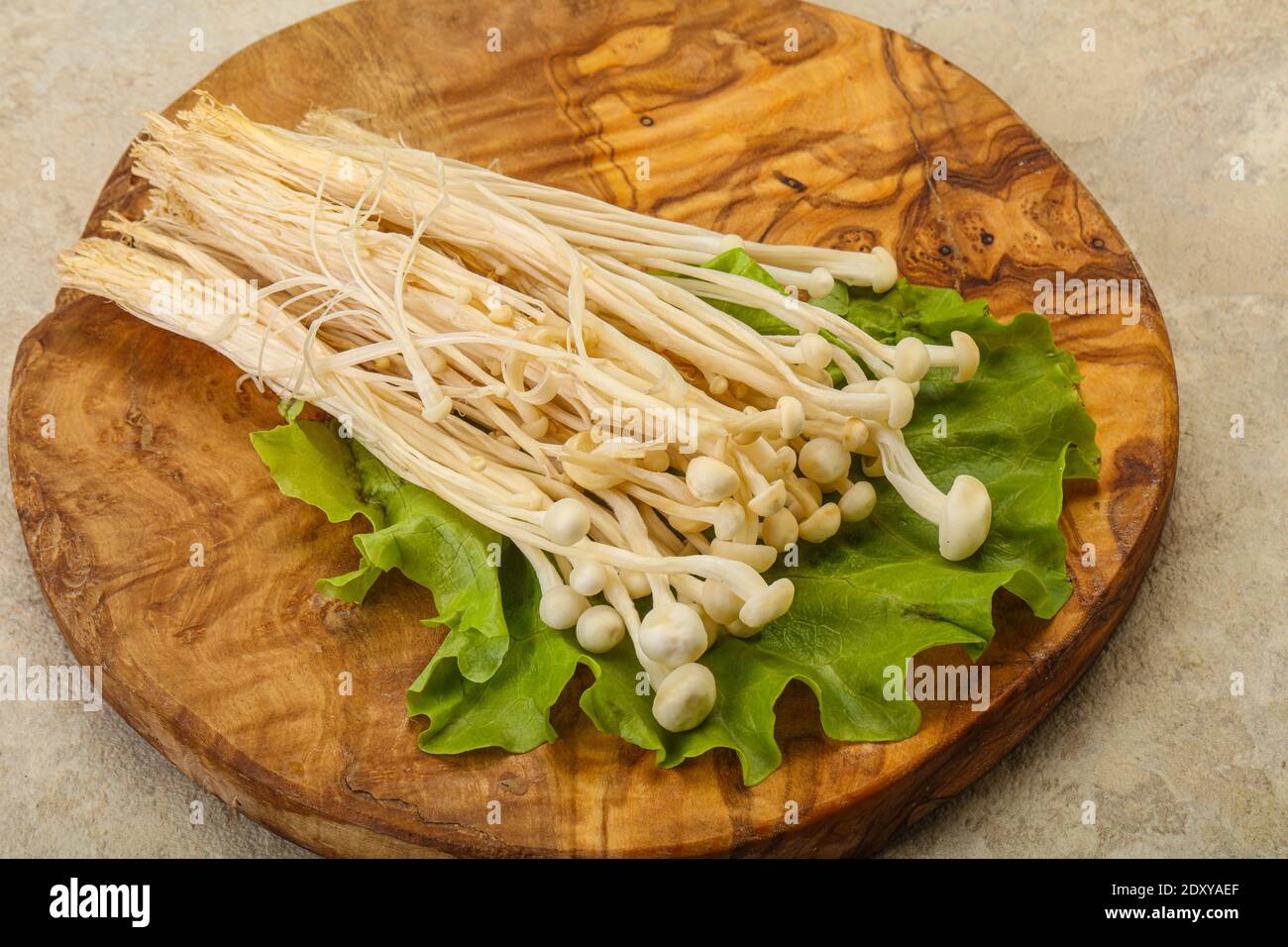 Raw Japanese Enoki mushrooms for cooking Stock Photo - Alamy