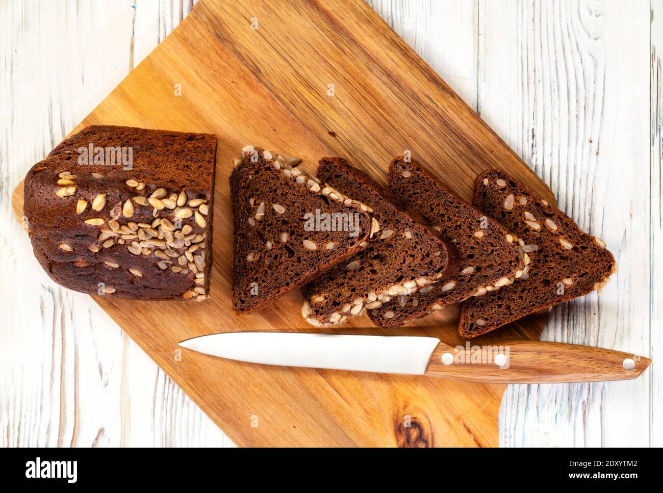 black German bread sliced with a knife Stock Photo - Alamy