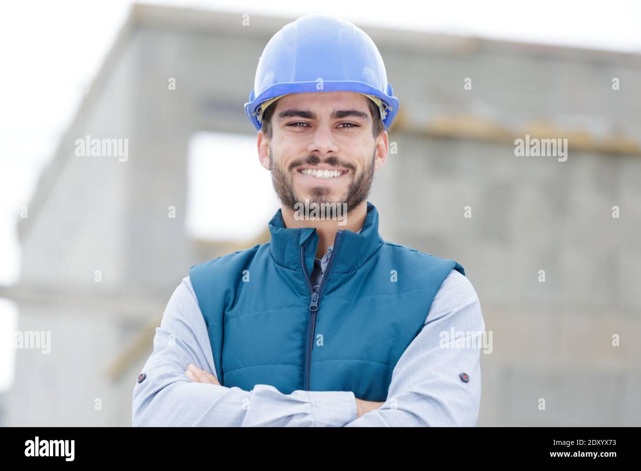 a happy builder smiling at the camera Stock Photo - Alamy