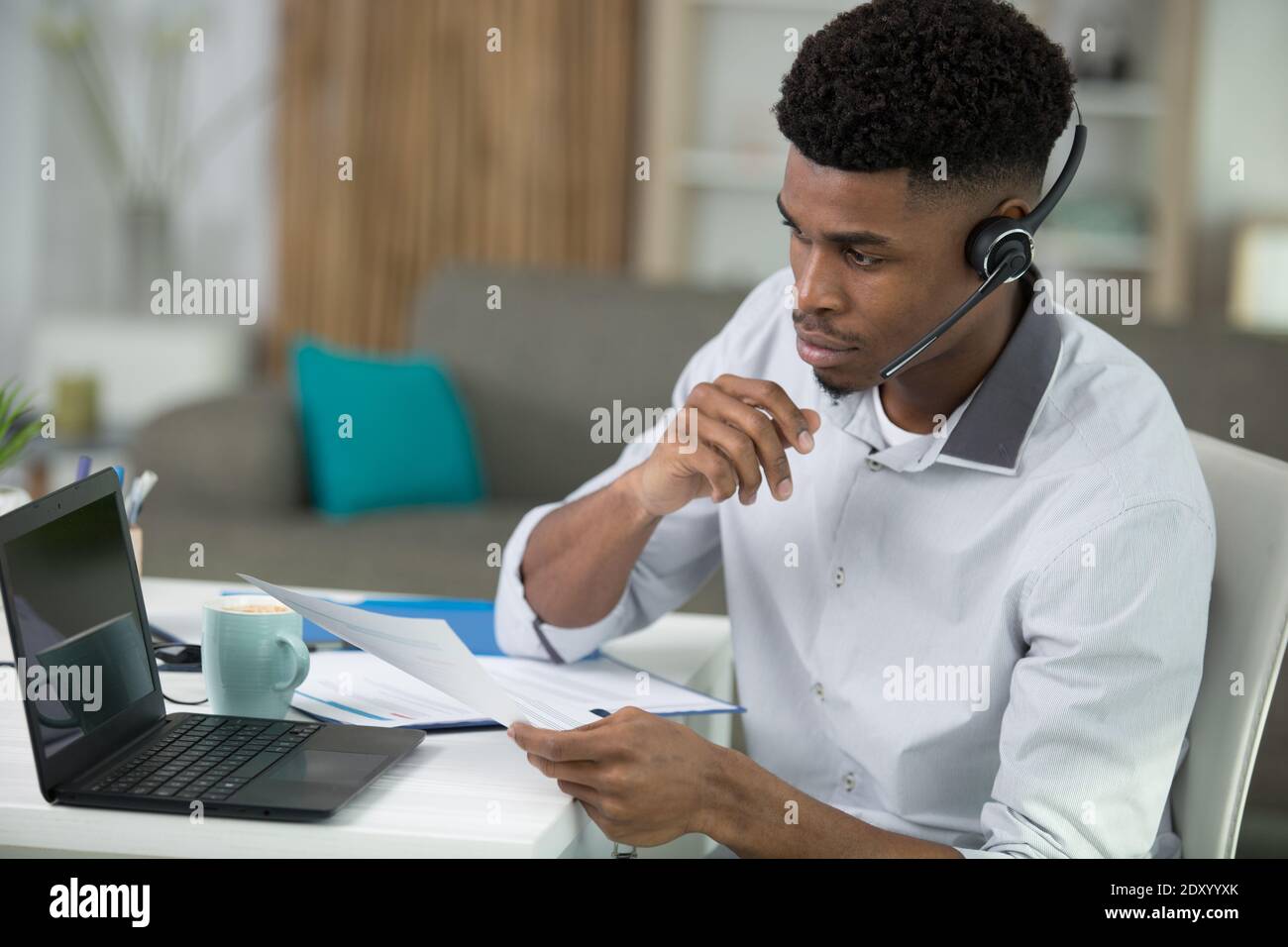 telemarketer man frustrated and pointing to the front Stock Photo - Alamy