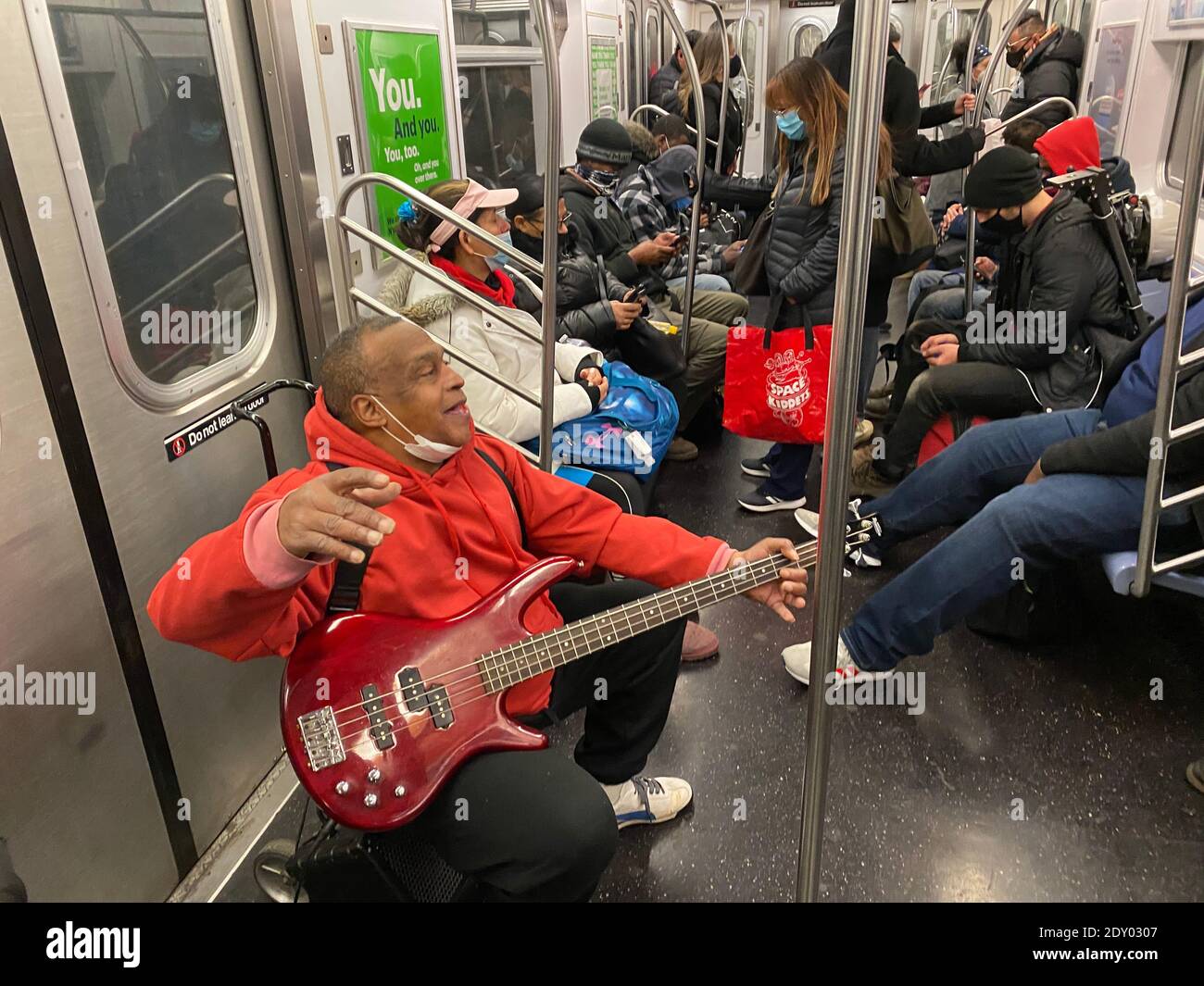 Man entertains riders on a subway train in Manhattan during the ...