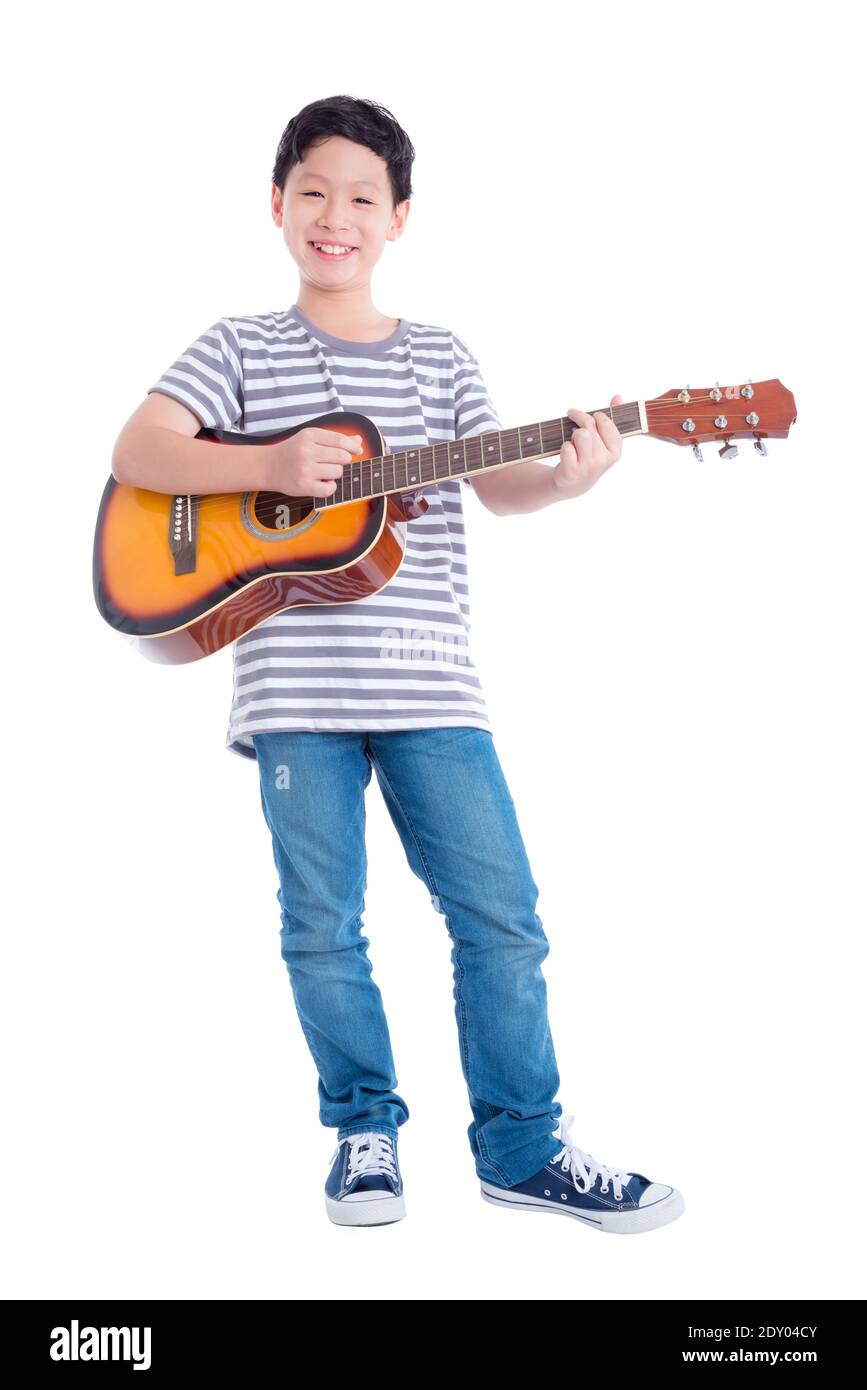 Boy playing guitar smiling Cut Out Stock Images & Pictures - Alamy