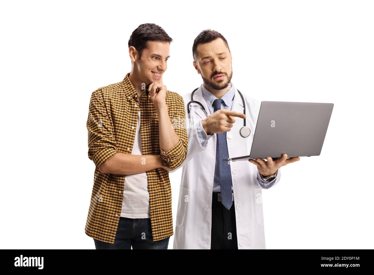 Doctor with a young male patient showing a laptop computer and pointing ...