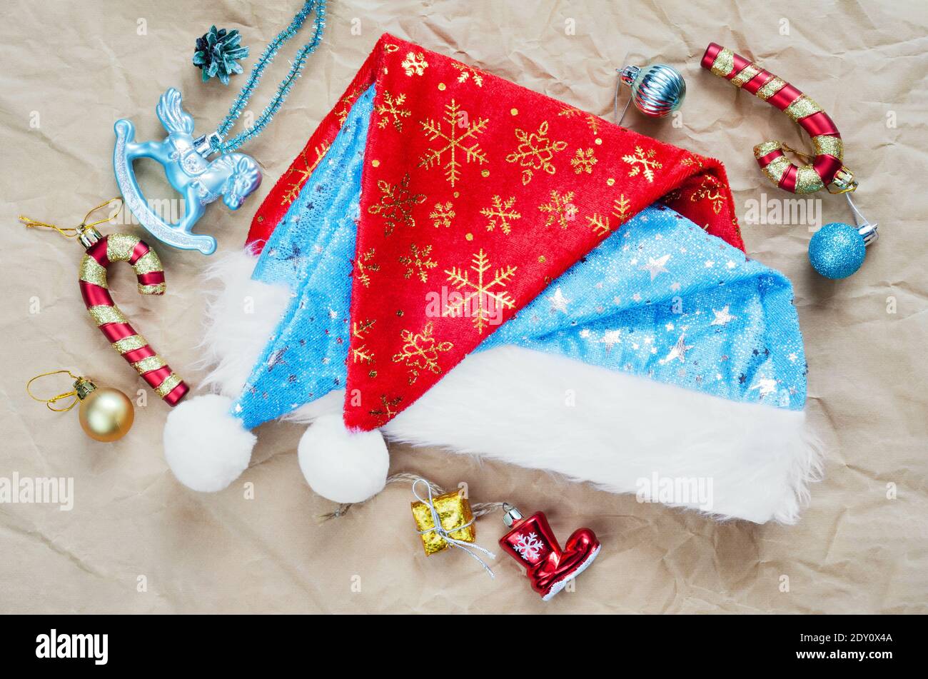 Christmas hats and decorations on crumpled paper Stock Photo - Alamy