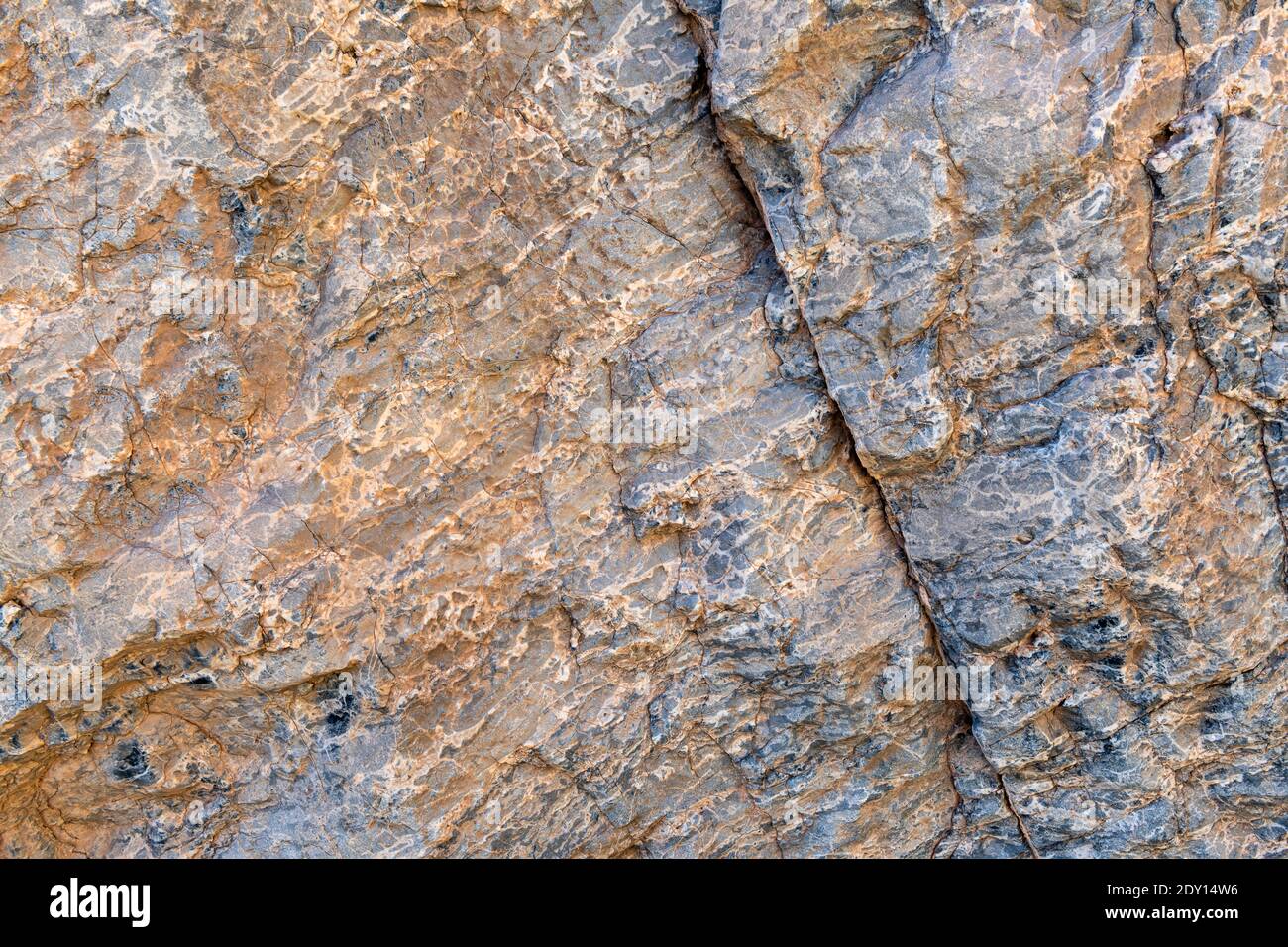 A diagonal crack through a rock on the wall of Titus Canyon in Death ...