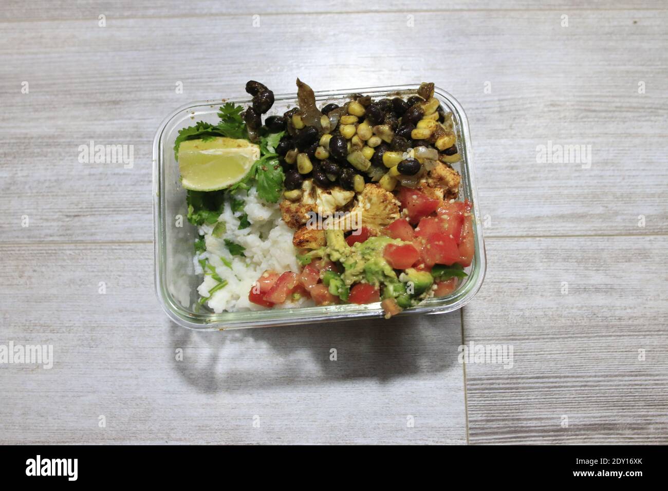 meal prep in glass lunch boxes of burrito bowls Stock Photo - Alamy