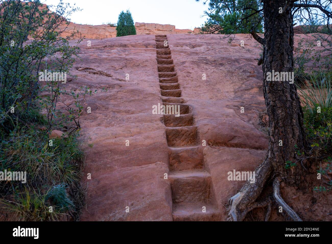 Hiking steps carved into a staircase in a steep rock, in Red Rocks open ...