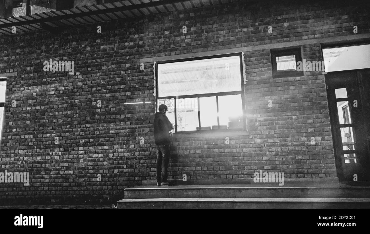 Exit sign man standing Black and White Stock Photos & Images - Alamy