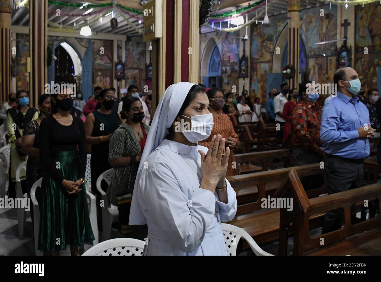 People attending mass prayers conducted on the Christmas Eve at Mount ...