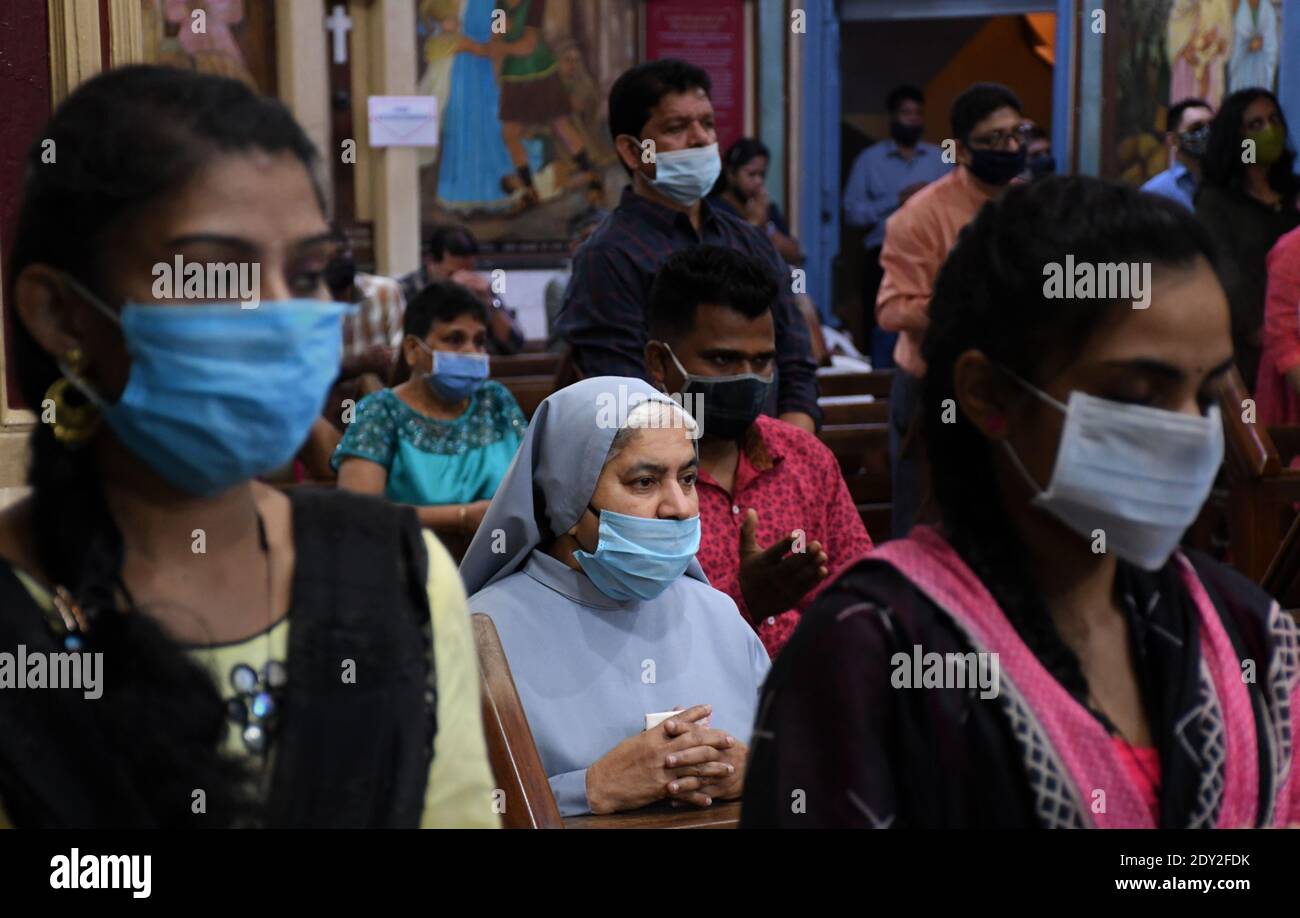 People attending mass prayers conducted on the Christmas Eve at Mount ...