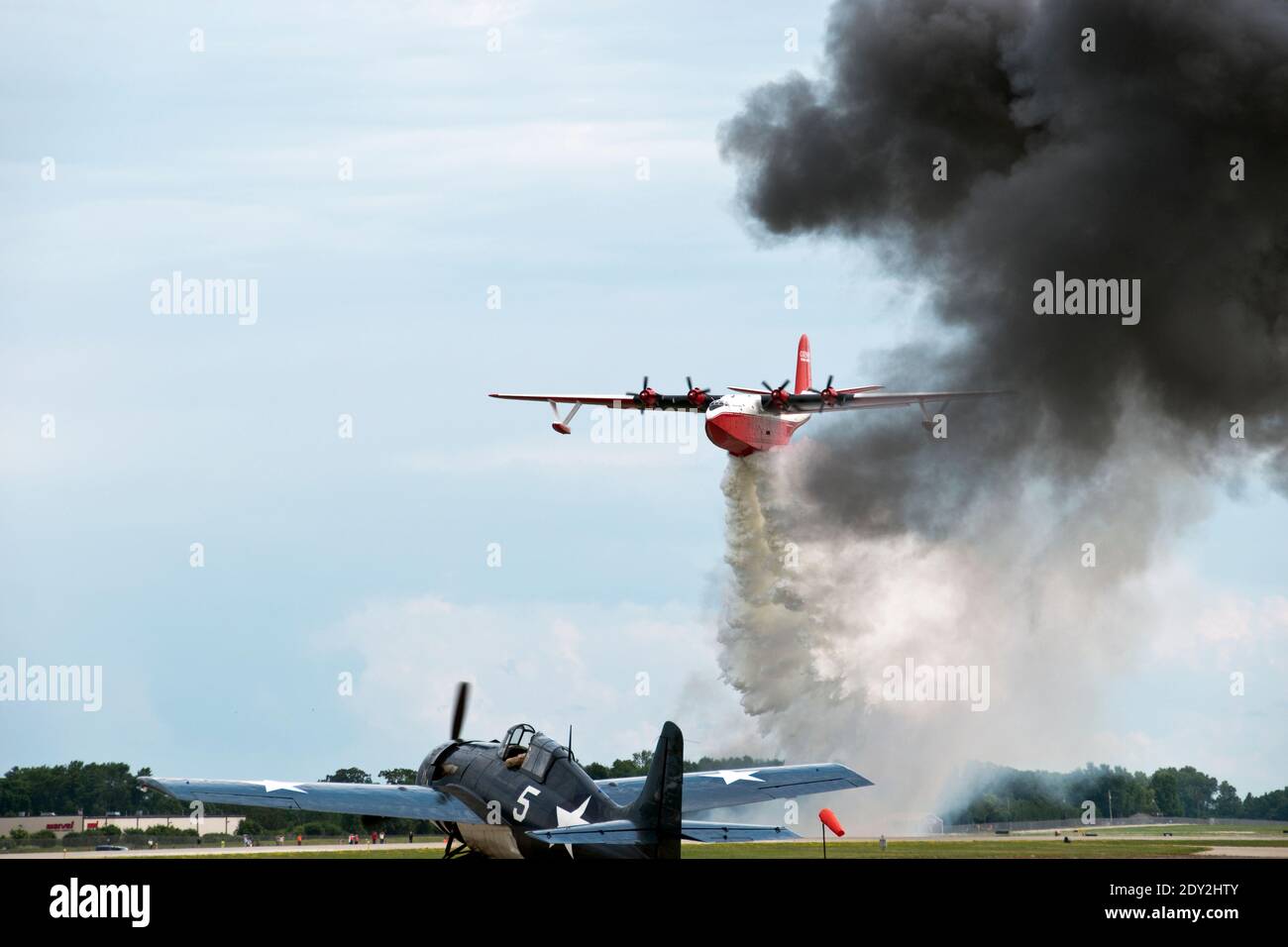 The Martin Mars, the world’s largest fire-fighting water bomber drops ...