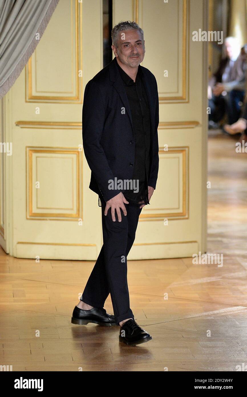 Designer Antonio Grimaldi makes an appearance on the runway after his ...