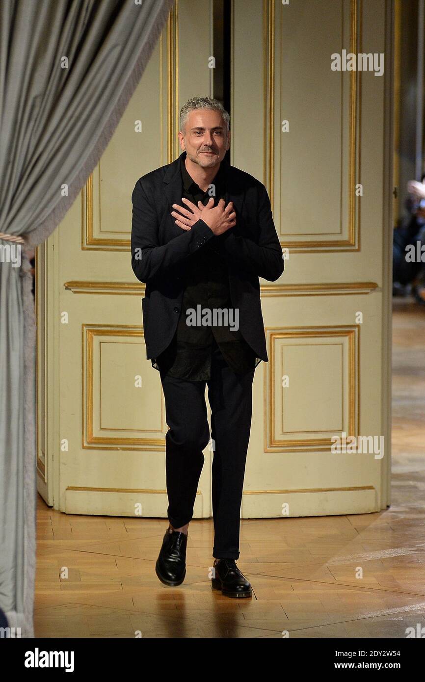 Designer Antonio Grimaldi makes an appearance on the runway after his ...