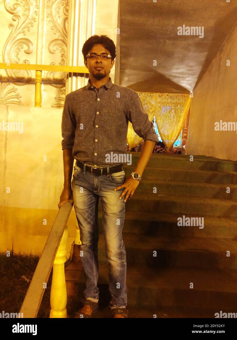 Portrait Of Young Man Standing On Steps Stock Photo - Alamy