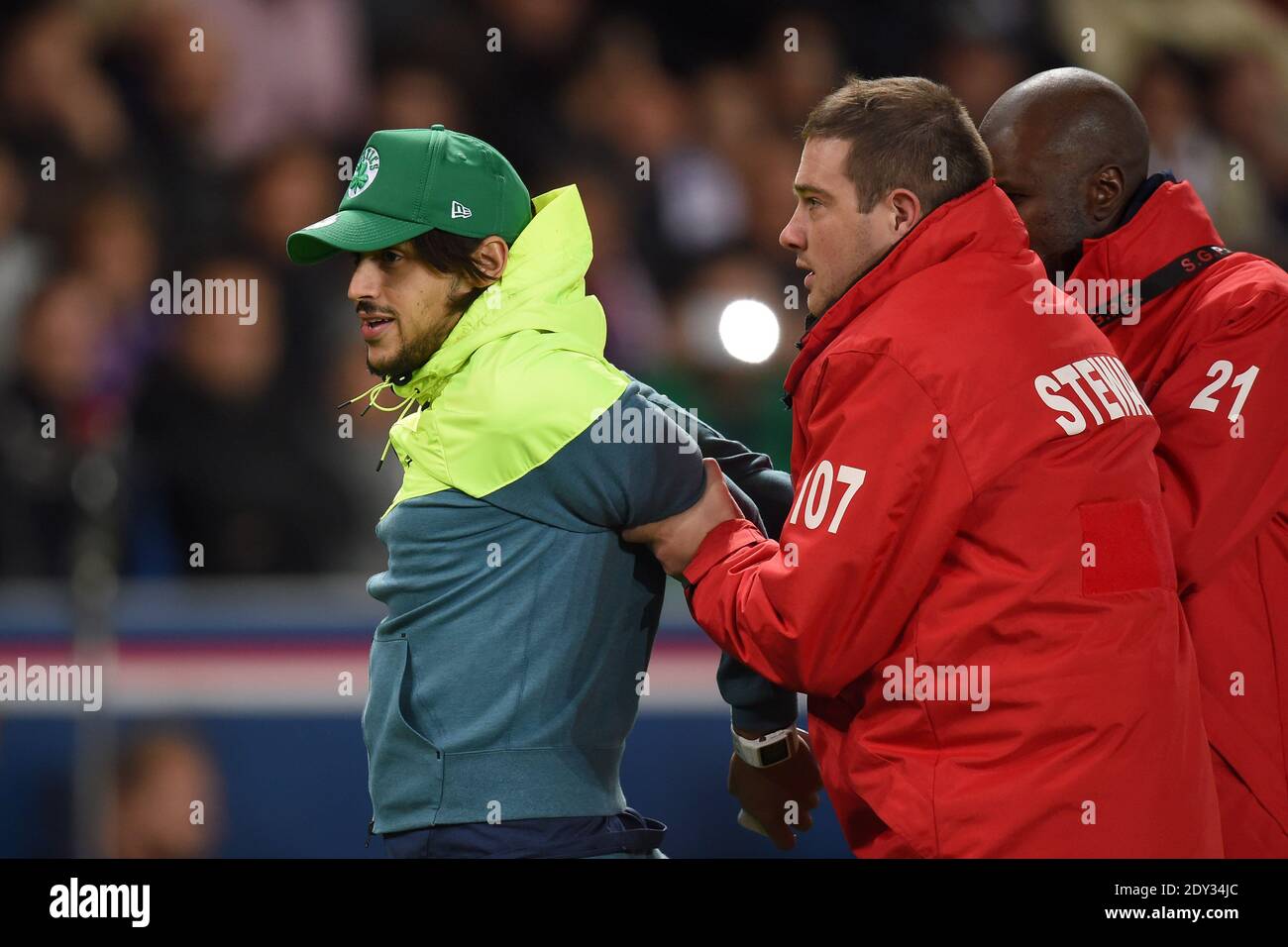 A fan runs invading the pitch during the French League soccer match ...