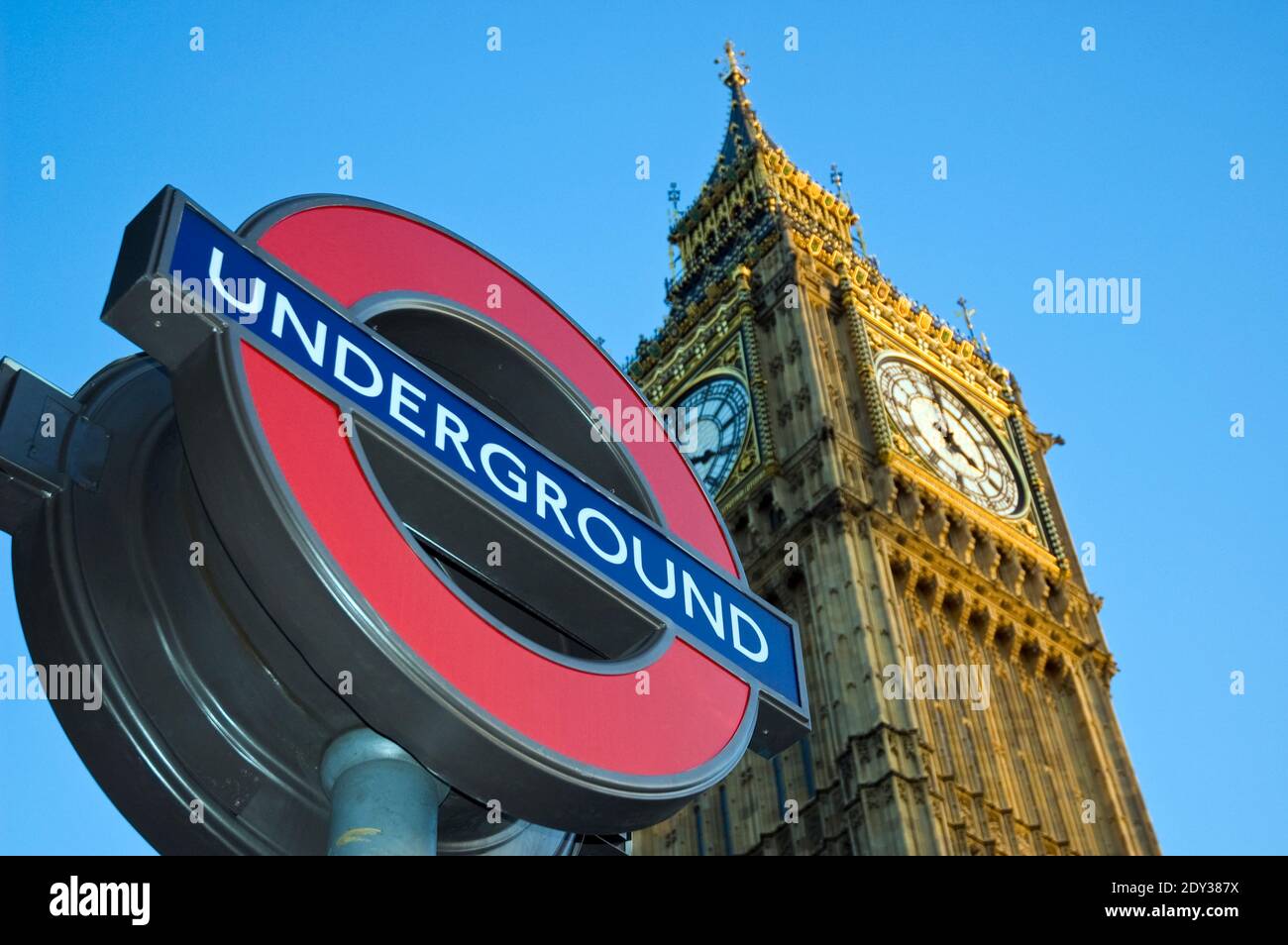 A London "underground" station sign and "Big Ben," the famous neo ...