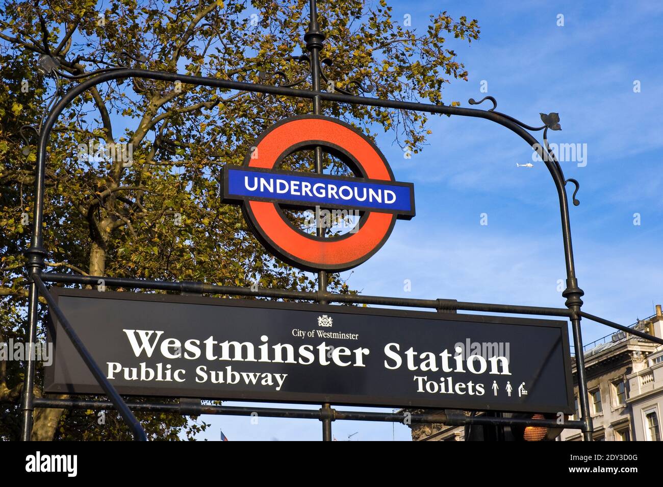 A classic red "Underground" sign at the Westminster Underground Station ...