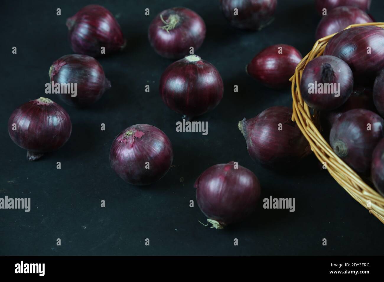 sweet red onions on background Stock Photo - Alamy