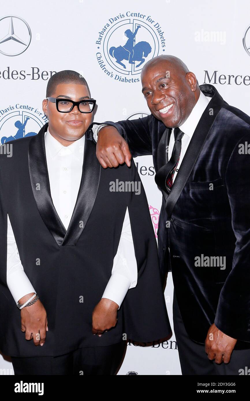 EJ Johnson and Earvin 'Magic' Johnson attend the 2014 Carousel Of Hope ...