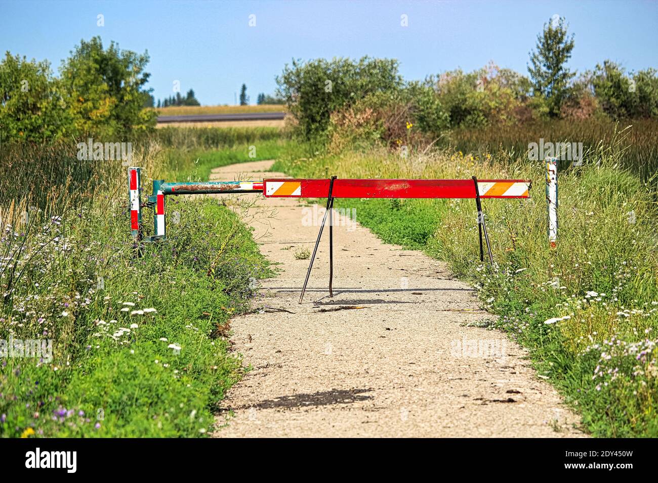 A walking path that has been closed off by barriers Stock Photo - Alamy