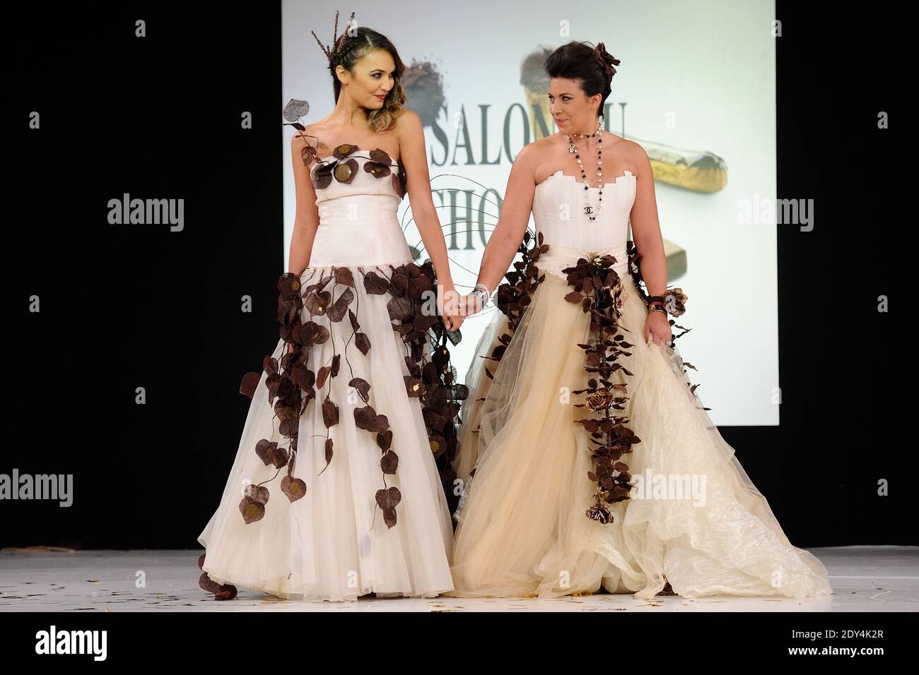 Valerie Begue displaying a dress designed by Aurelie Cherell and ...