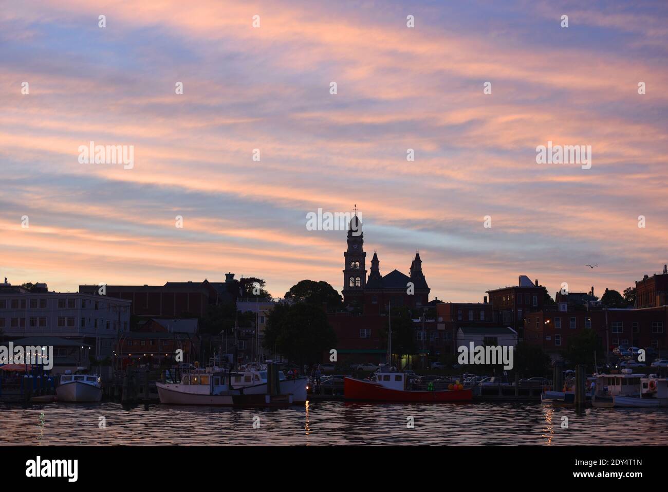 Gloucester city skyline at sunset from inner harbor, Massachusetts MA ...