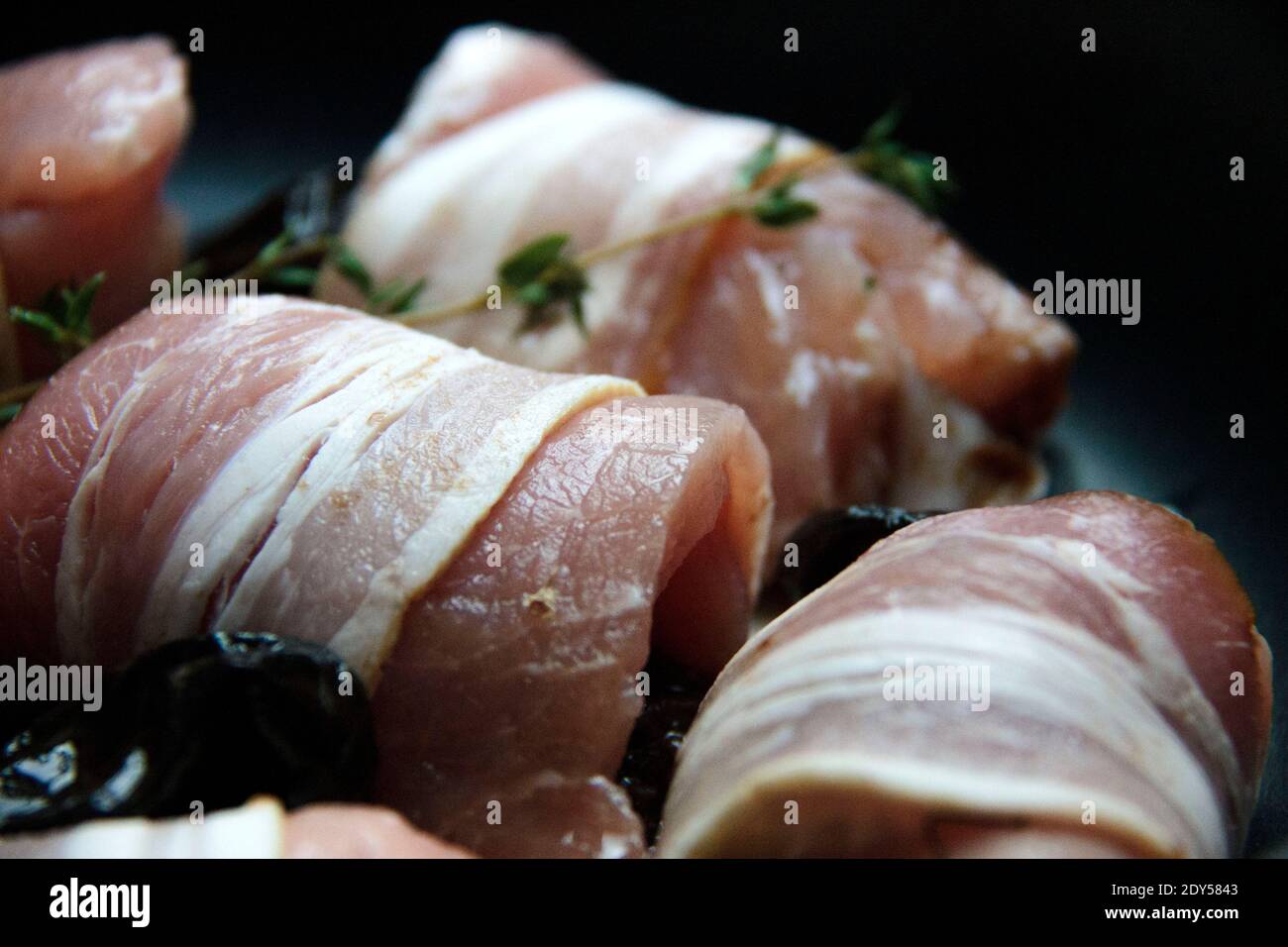Raw pork rolls with bacon. Cooking background Stock Photo - Alamy