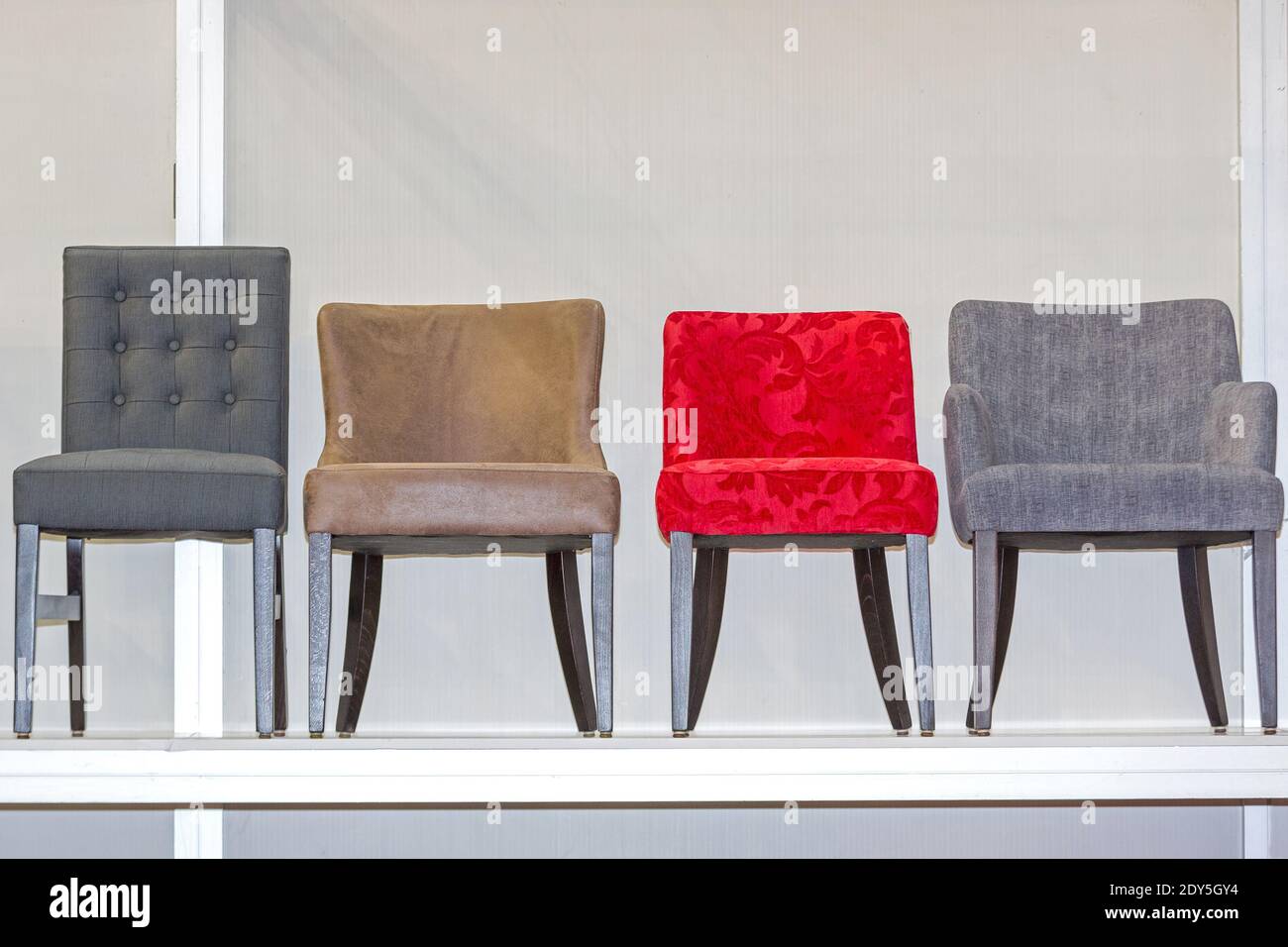 Four New Colourful Chairs Variety at Shelf Stock Photo - Alamy
