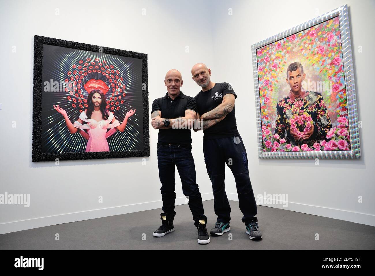 Pierre and Gilles posing in front of Stromae Portrait during Paris ...