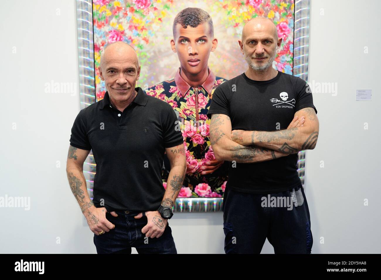 Pierre and Gilles posing in front of Stromae Portrait during Paris ...