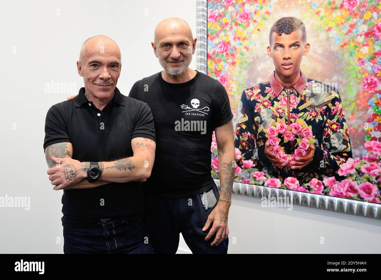 Pierre and Gilles posing in front of Stromae Portrait during Paris ...