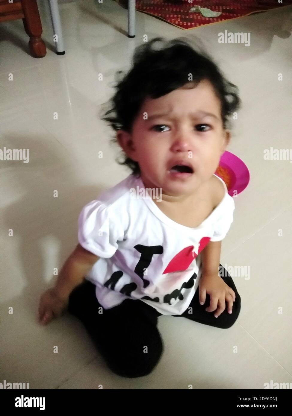 Portrait girl kneeling on floor hi-res stock photography and images - Alamy